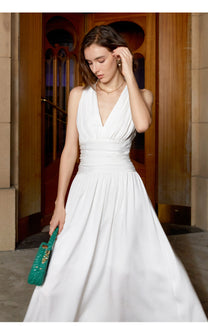 Luxurious blend of silk a hanging neckline, and sleeveless V-neck dres ...
